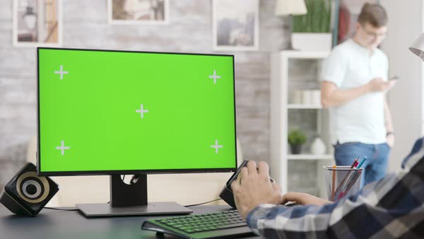 Parallax zoom in shot of man looking at green screen isolated mock-up ...