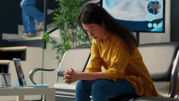 Elderly person waiting to attend checkup visit with doctor, sitting in ...