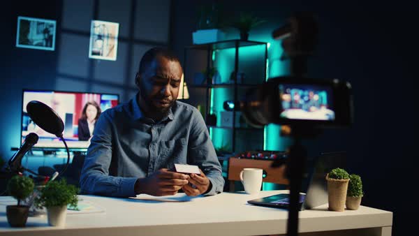 Tech content creator filming brand sponsored mini RGB lights device ...