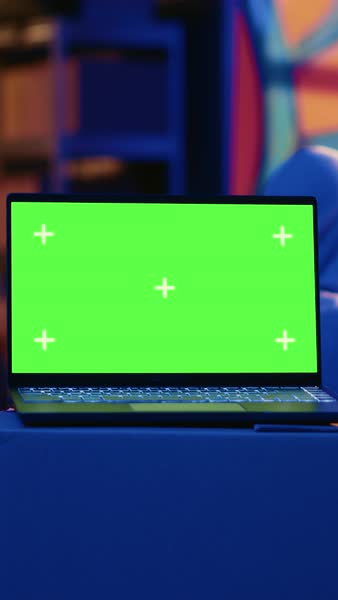 Vertical video Green screen laptop in bunker with graffiti walls left ...