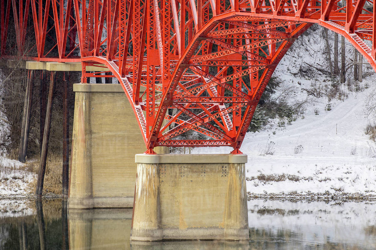 A close up of the support structure of a red bridge in Ione, Washington ...