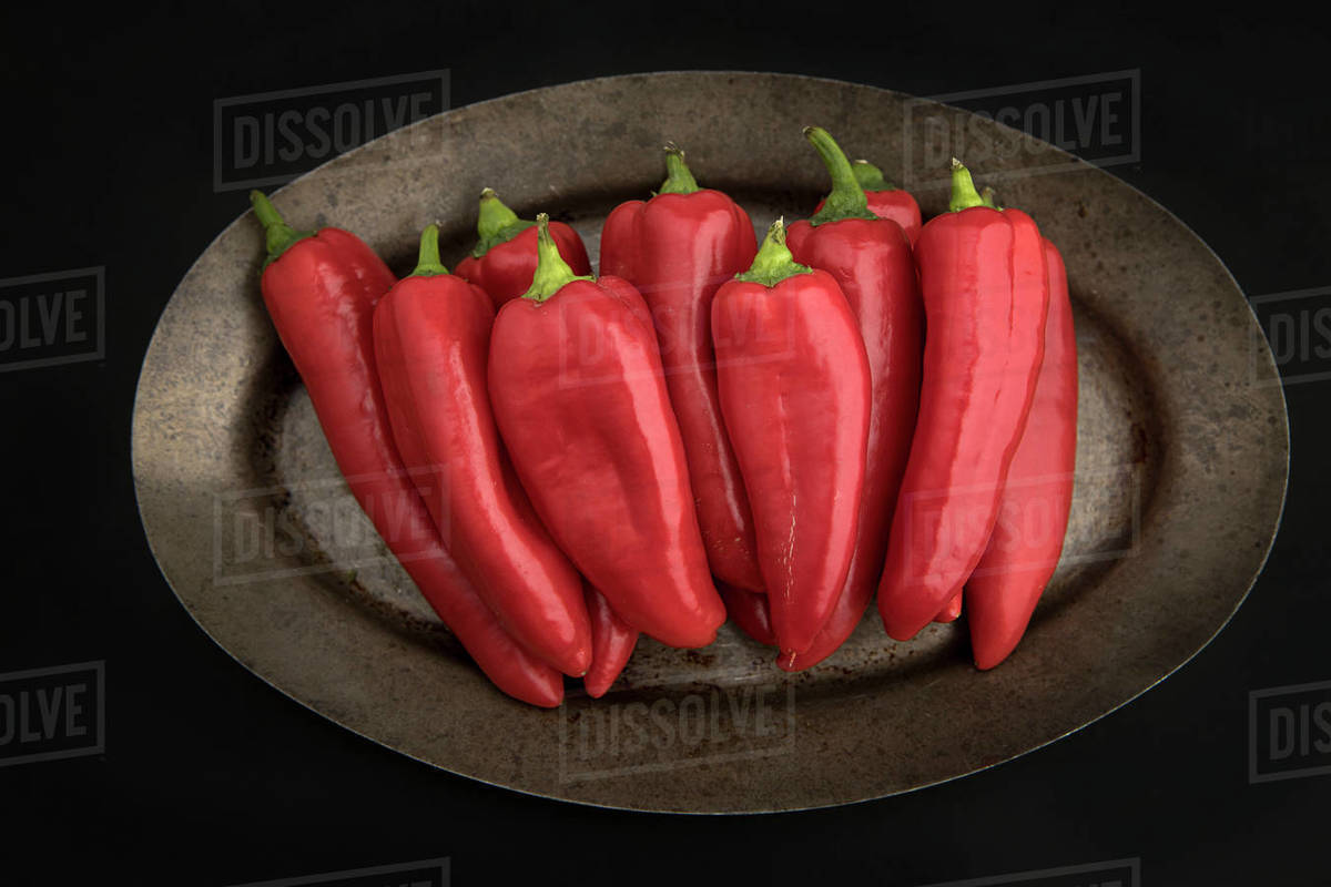 An overview of spicy red peppers stacked on a platter. - Royalty-free ...