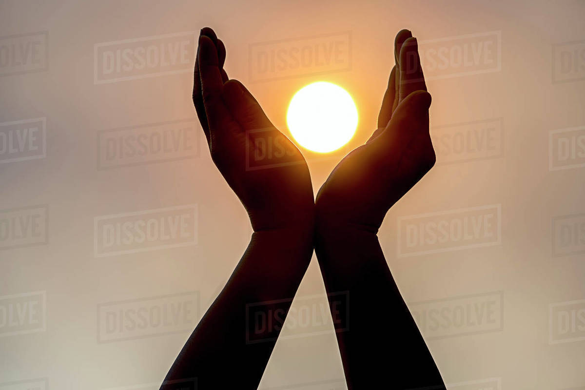 Conceptual image of holding the sun in two hands. - Royalty-free Stock ...