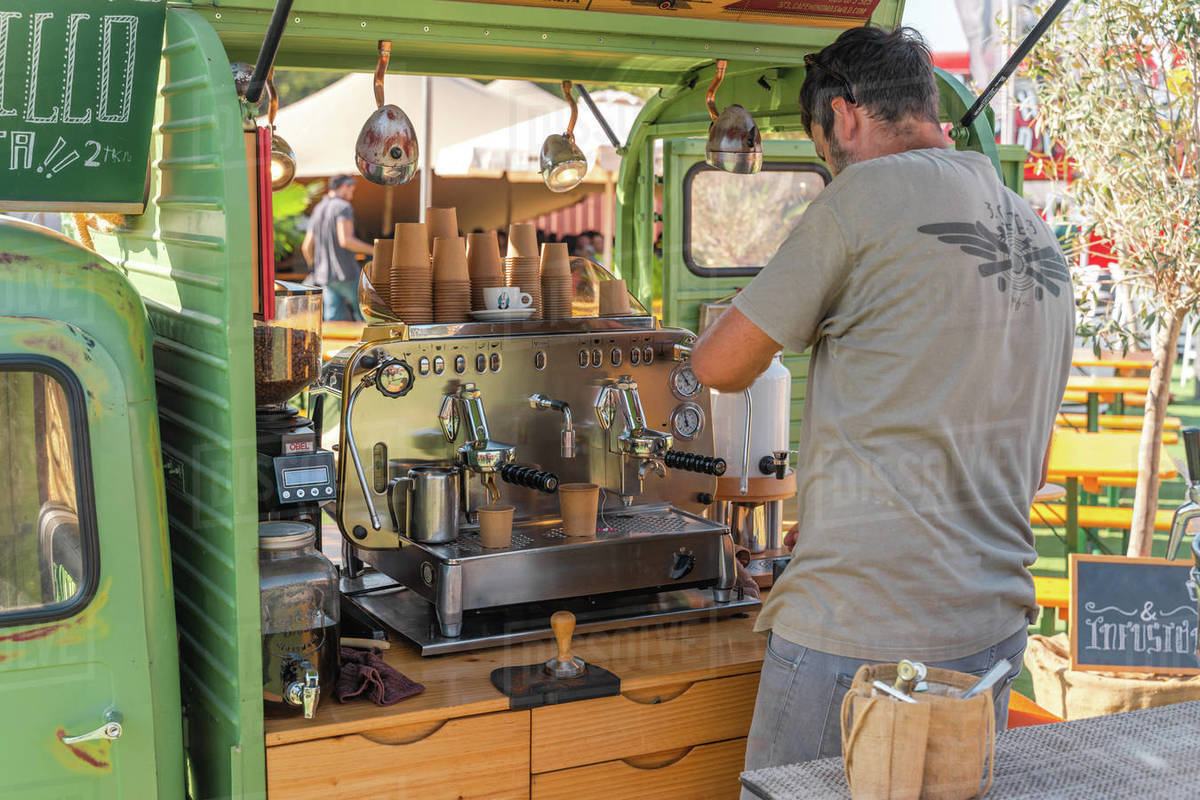 Barista Making coffee with retro style coffee machine. Filling recycled ...