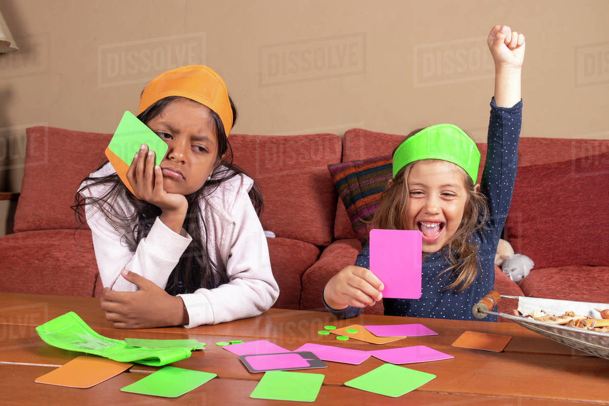 Girl celebrates after winning her card game - Royalty-free Stock Photo ...