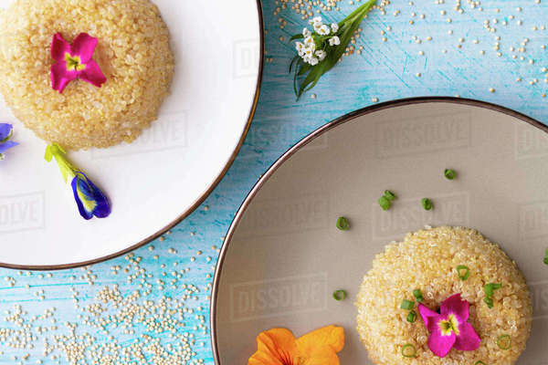 Quinoa plate presentation decorated with edible flowers - Royalty-free ...