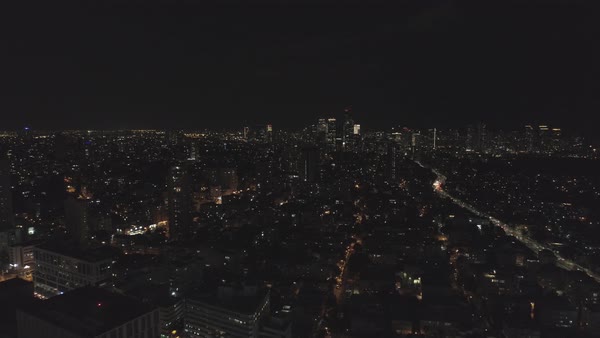 City Night light scene from a drone, Aerial above modern Tel Aviv city ...