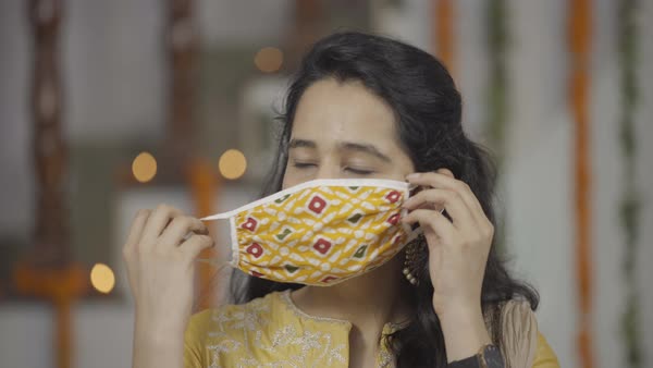 Indian girl in Indian ethnic attire wearing Coronavirus protection mask ...