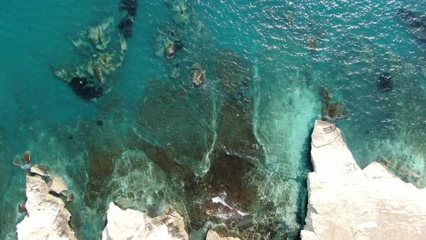 Sparkling waves rolling to rocks in Mediterranean Sea. Aerial view of ...