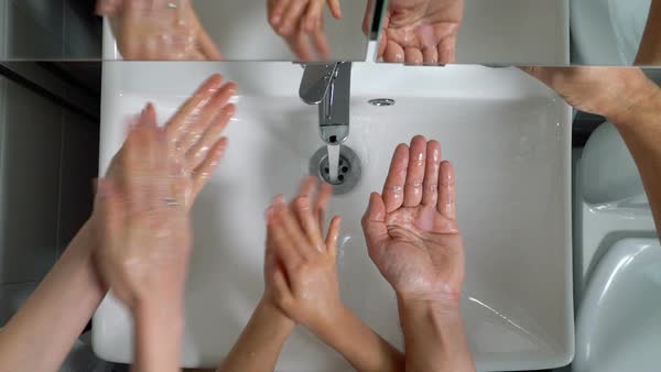 Family couple with child washing hands in bathroom at home, Coronavirus ...