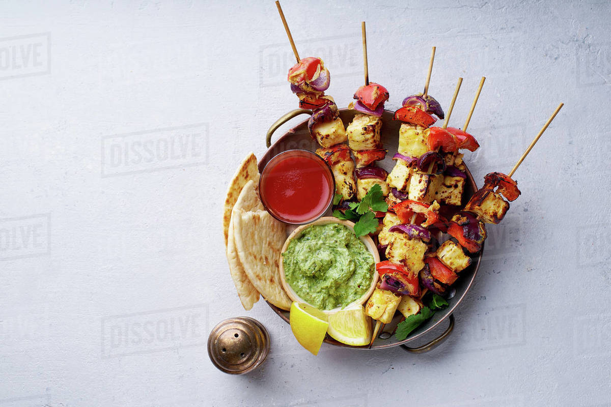 Paneer tikka starter kebabs with mint chutney and chapati. Traditional ...