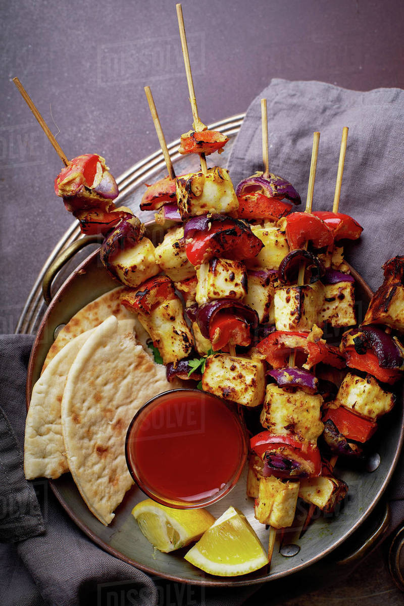 Paneer tikka starter kebabs with mint chutney and chapati. Traditional ...