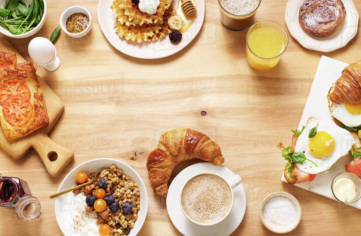 Overhead shot of brunch menu on wooden table with copy space. Healthy ...