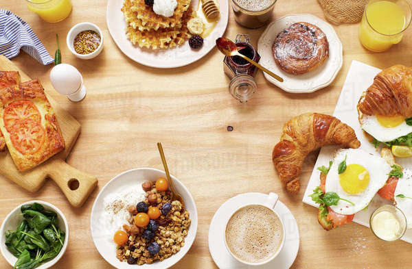 Overhead shot of brunch menu on wooden table with copy space. Healthy ...