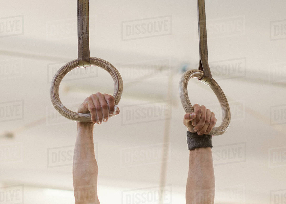 Strong hands close up hanging from gymnastics rings - Royalty-free ...