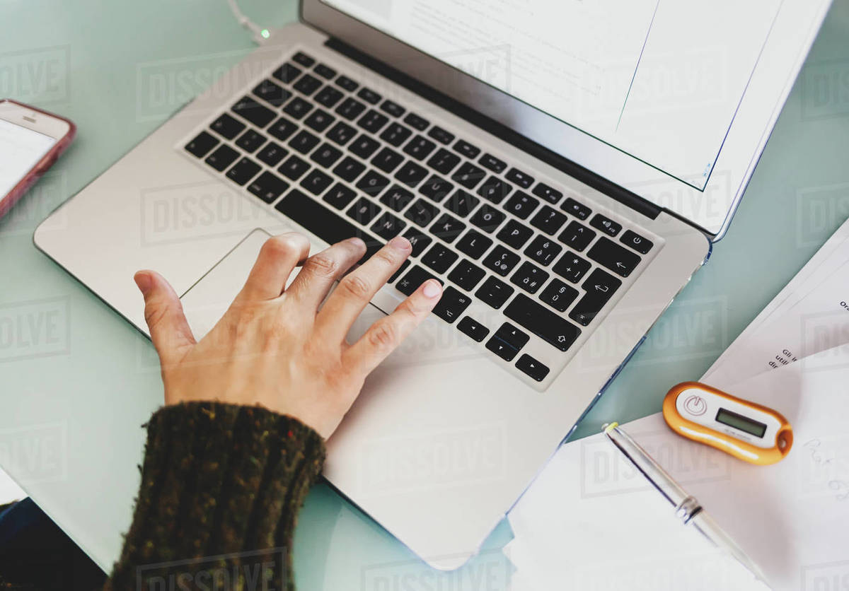 Woman using a laptop computer at home, smart working concept ...