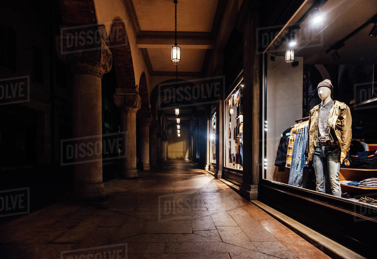 night shop window with clothes in italy - Stock Photo - Dissolve