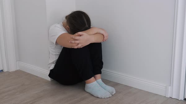 Sad Hurt Punished Teenager Girl Sitting On Floor In Corner At Wall - 4K ...