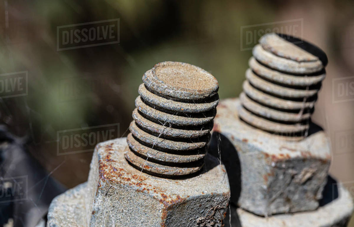 Photograph of the thread of a rusty galvanised bolt and nut securing a ...