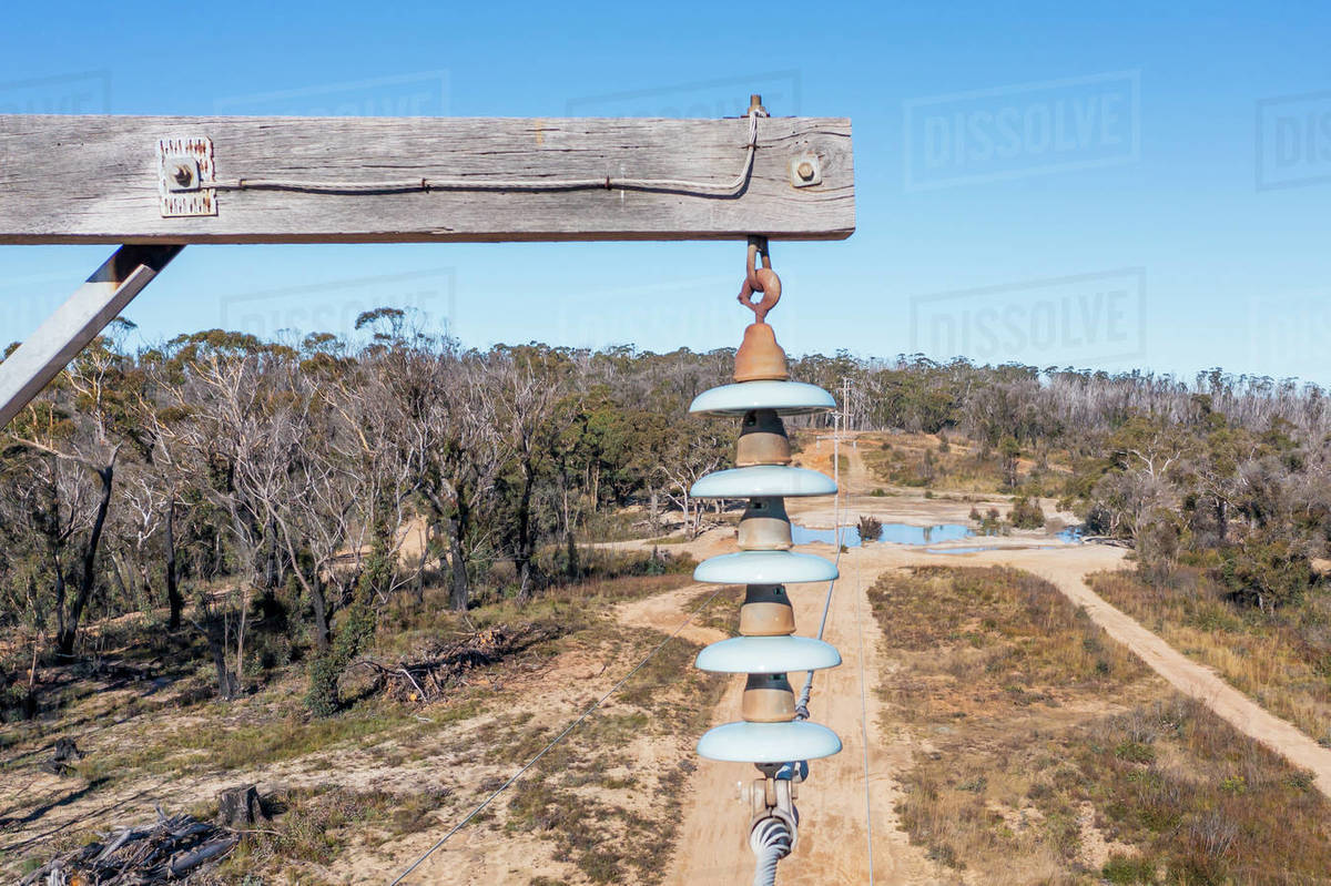 Drone aerial photograph of a telephone pole and wires in a forest ...