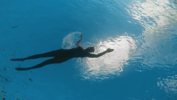 Boy swimming silhouette underwater view in summer. - 4K Royalty-free ...