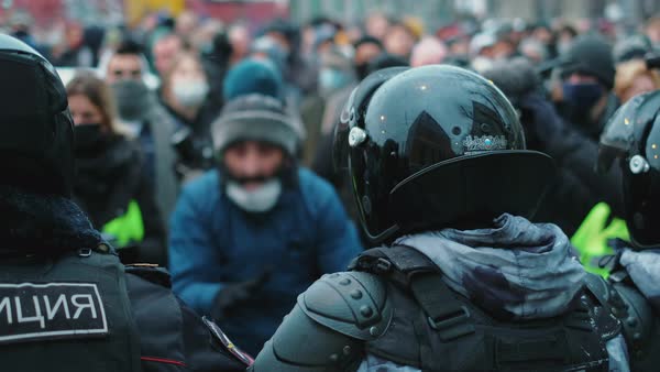 Angry protest man activist has aggressive talk with riot police officer ...