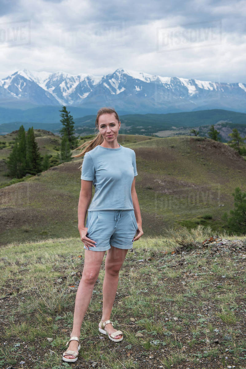 Woman on the big mountain background, vacation in the mountain - Stock ...