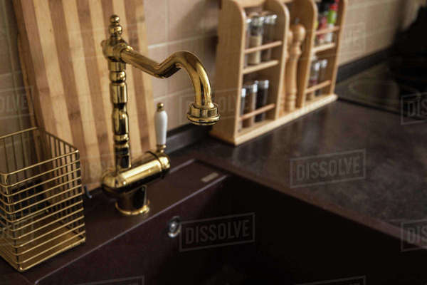 Photo of new modern kitchen interior. Luxury gold water tap - Royalty ...