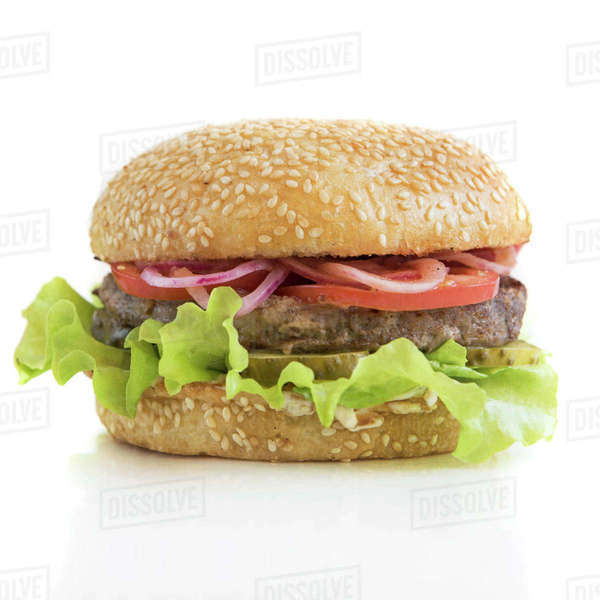 Tasty classical burger with meat cheese lettuce onion, tomato isolated ...