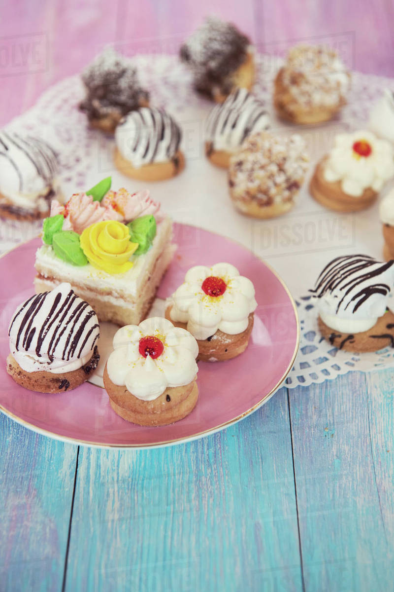 Different cakes composition on gradient background - Stock Photo - Dissolve
