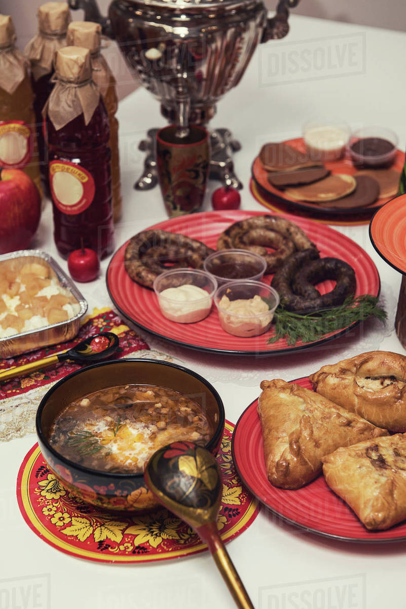Table with traditional russian food decorated in russian style - Stock ...