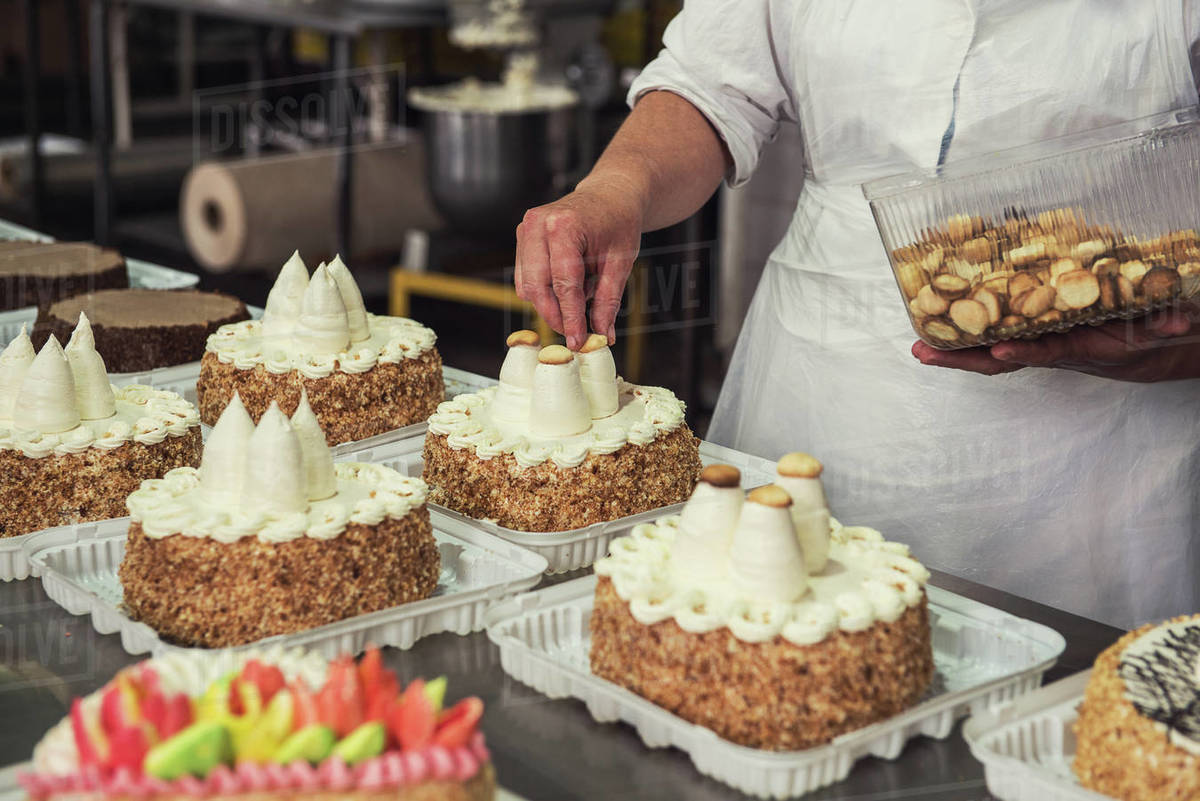 Manual cakes production on factory - Stock Photo - Dissolve