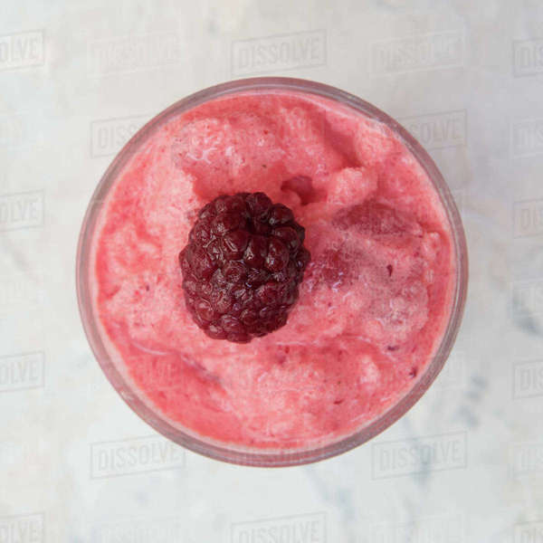 Blackberry smoothie on a white concrete background. Square cropping ...