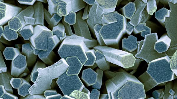 Animated coloured scanning electron micrograph (SEM) of crystals of ...