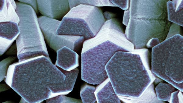 Animated coloured scanning electron micrograph (SEM) of crystals of ...