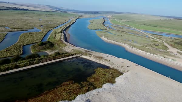 Cuckmere Haven estuary and beaches. Aerial footage at the mouth of the ...