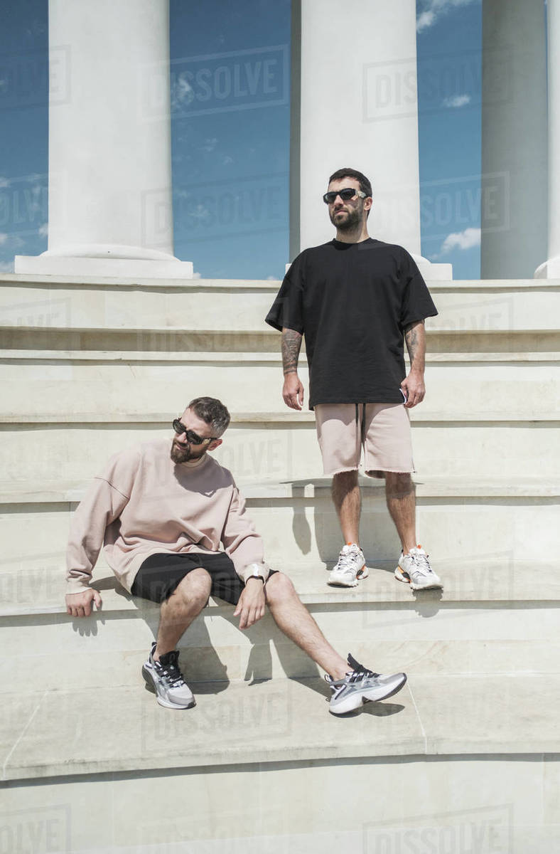 Two guys in trendy clothes on the street - Royalty-free Stock Photo ...
