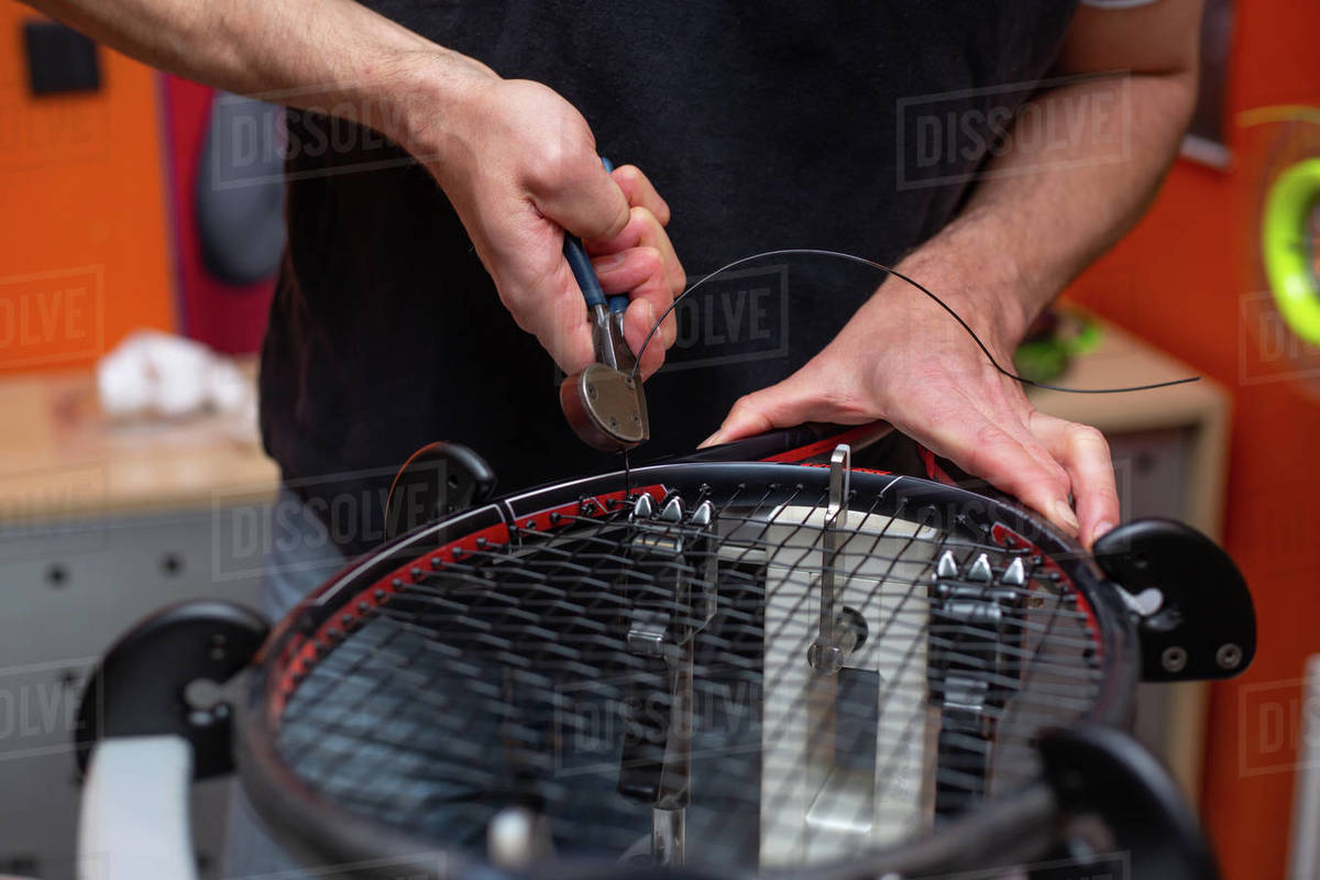 Process of stringing a tennis racket in tennis shop, sport and leisure ...