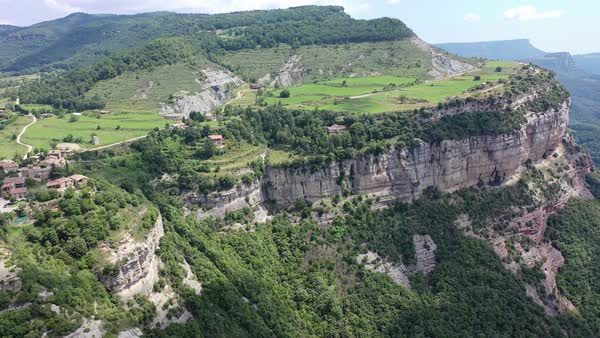 Scenic aerial view of small town of Tavertet located on edge of cliffs ...