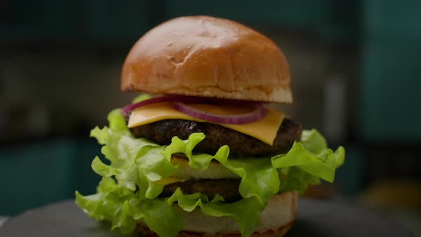 Double Cheeseburger Rotating Slow Motion. Big Burger close up. - Stock ...