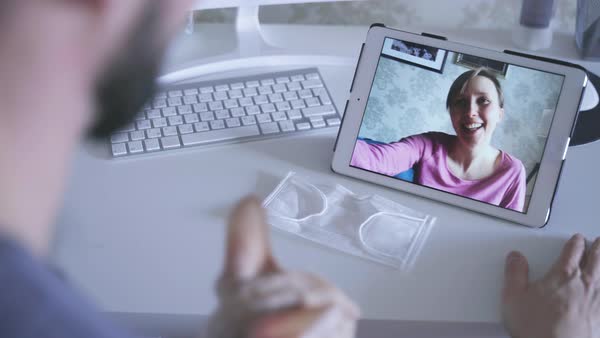 Young man and woman are having video call during viral quarantine at ...