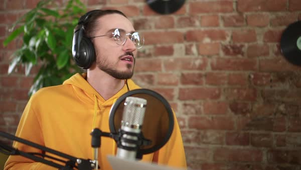 Influencer man talk, give interview on live radio broadcast. Vlogger ...