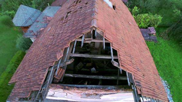 View inside house through broken roof aerial shot. Aerial shot of old ...