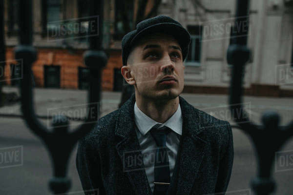 A man posing in the image of an English retro gangster of the 1920s ...
