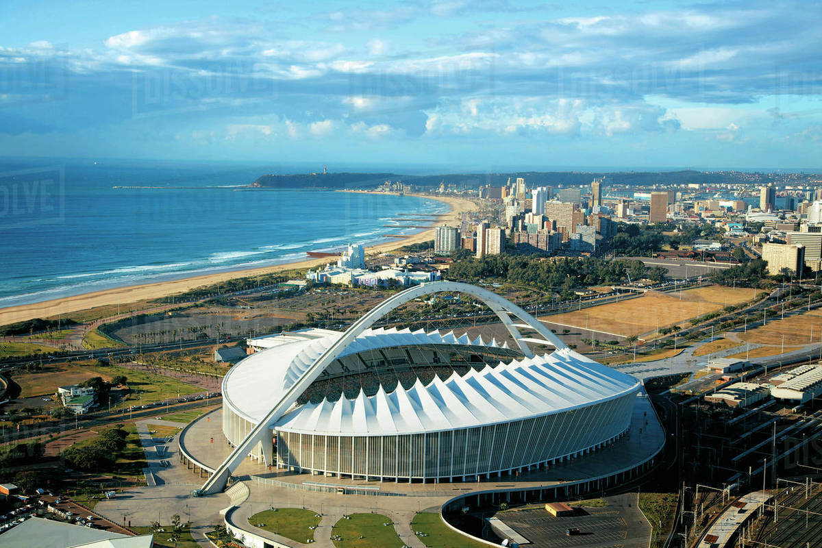 Moses Mabhida Stadium and Durban Skyline - Stock Photo - Dissolve