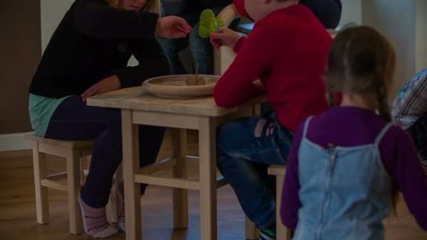 Two kids walking in front of the camera. Two unfocused kids walking ...