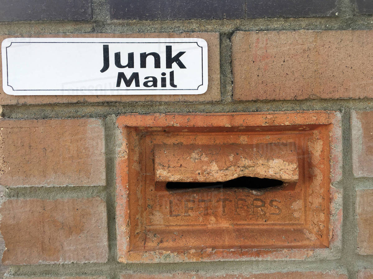 Junk mail sign on a letters box. - Royalty-free Stock Photo | Dissolve