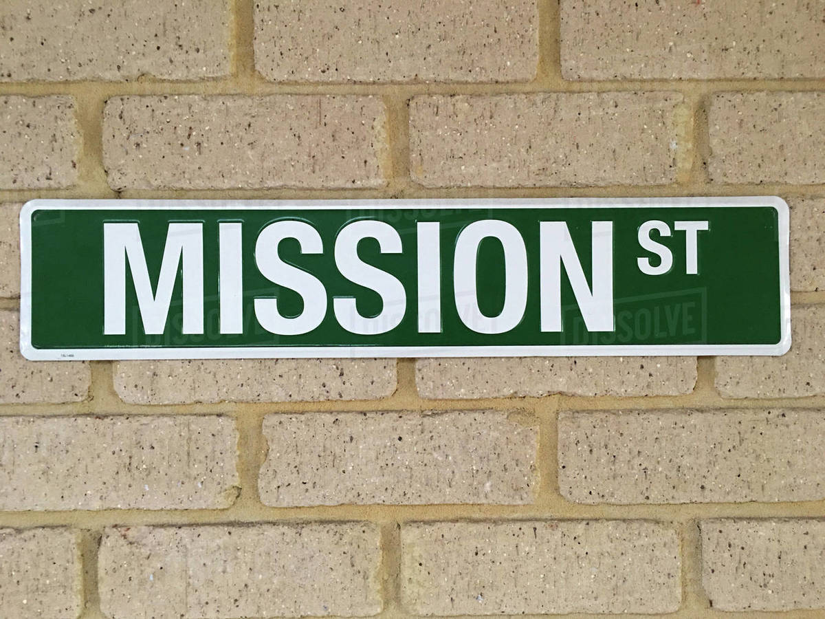 Mission street sign on a brick wall background and texture. - Royalty ...