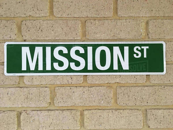Mission street sign on a brick wall background and texture. - Royalty ...