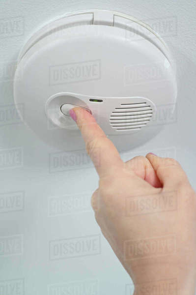 Female hand testing fire alarm. Close up - Royalty-free Stock Photo ...
